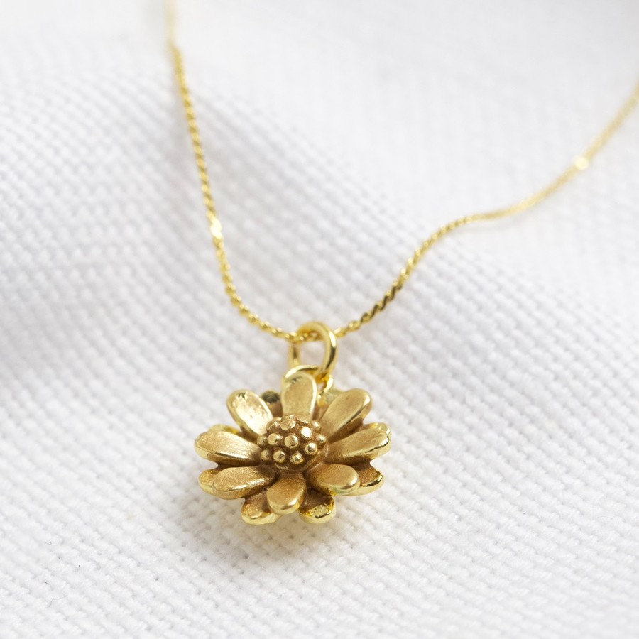 Worn gold daisy necklace